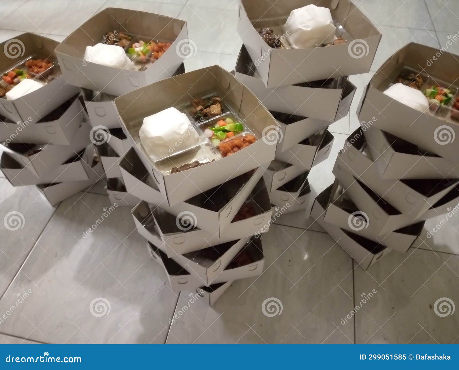 Boxed Rice With A Variety Of Side Dishes, Namely Chicken Wings, Eggs ...