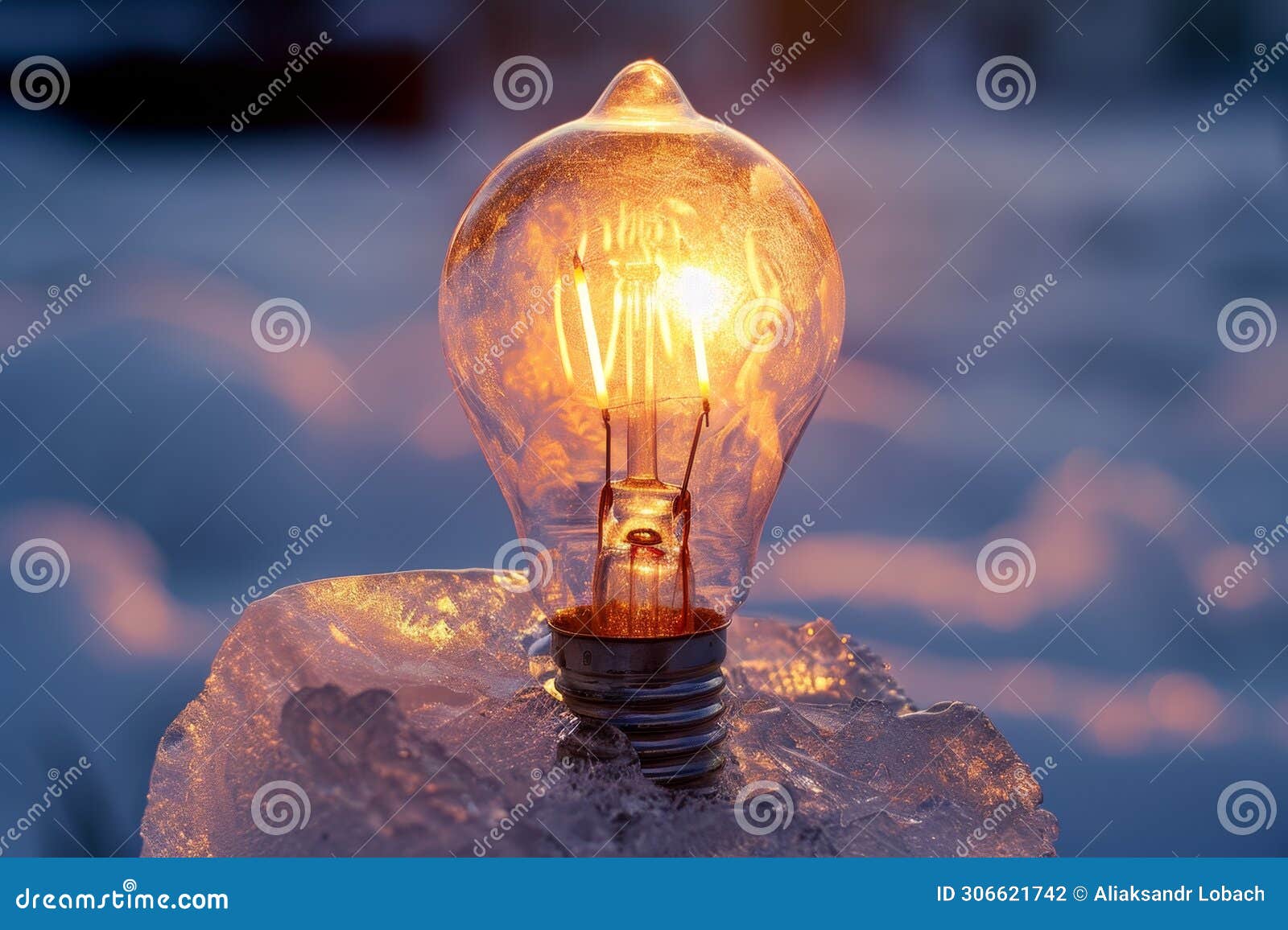 An Ordinary Incandescent Light Bulb Stands Outside in Winter and Burns ...