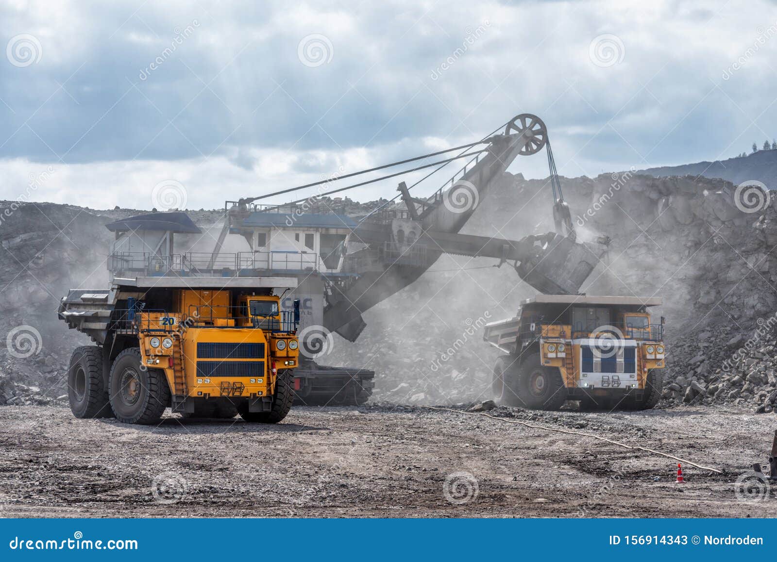 Ore Loading with a Powerful Excavator. Loading a Large Mining Truck ...