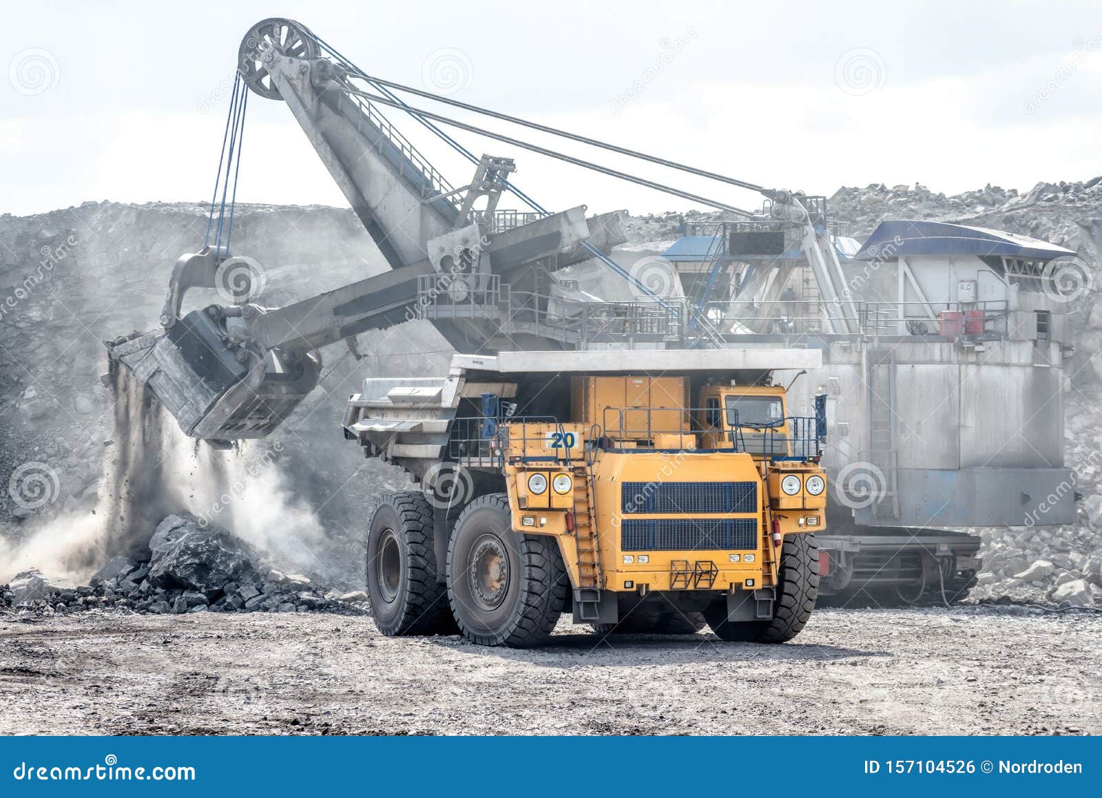 Ore Loading with a Powerful Excavator. Loading a Large Mining Truck ...