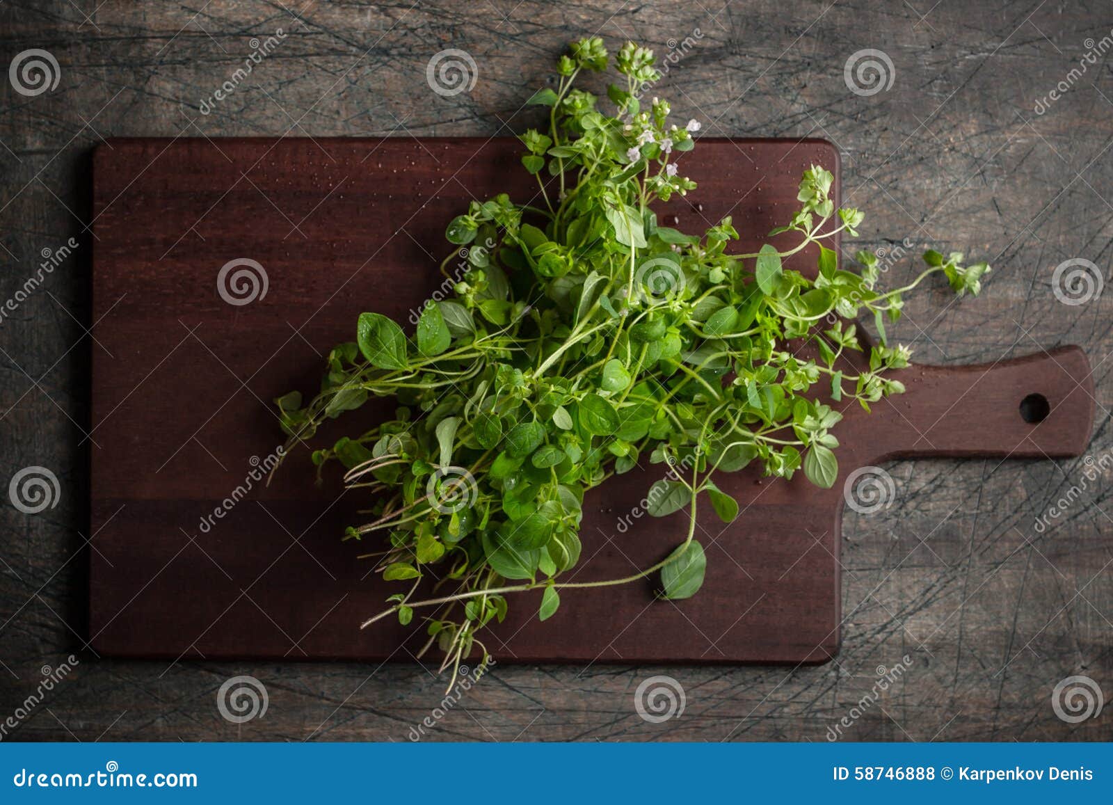 Oregano on the Kitchen Board on the Old Dark Table Stock Photo - Image ...