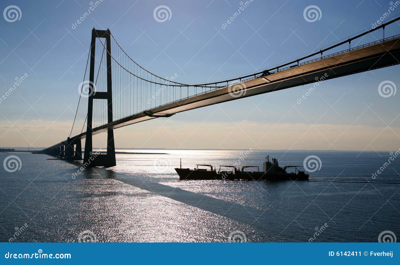 Oresund Bridge Sundown With A Flock Of Flying Birds Crossing The Scene ...