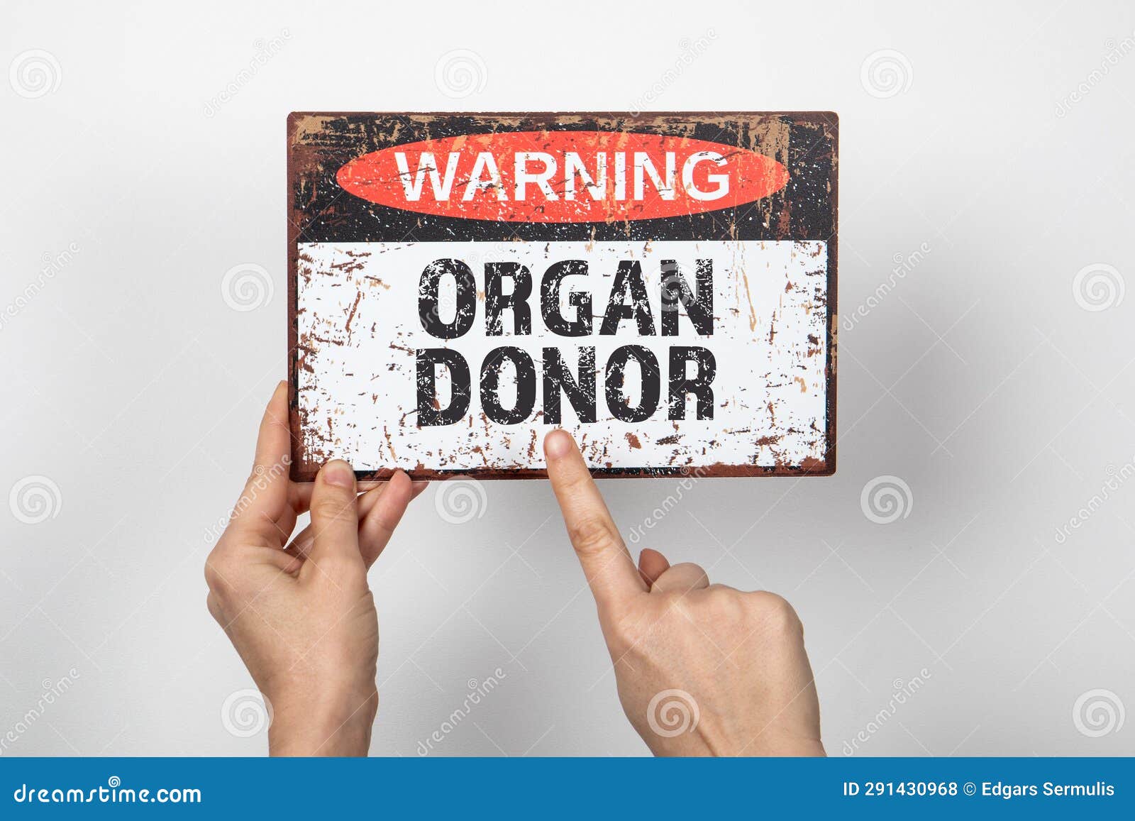Organ Donor. Warning Sign with Text in the Hands of a Woman Stock Photo ...