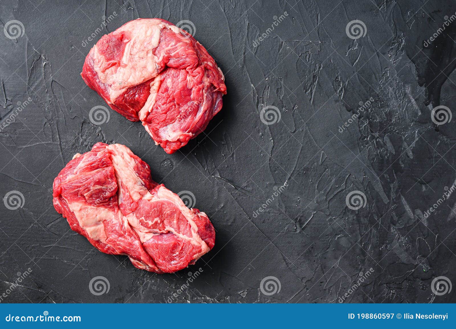 Organic Chuck Eye Roll Steak Cuts, Top View on Black Textured Table ...