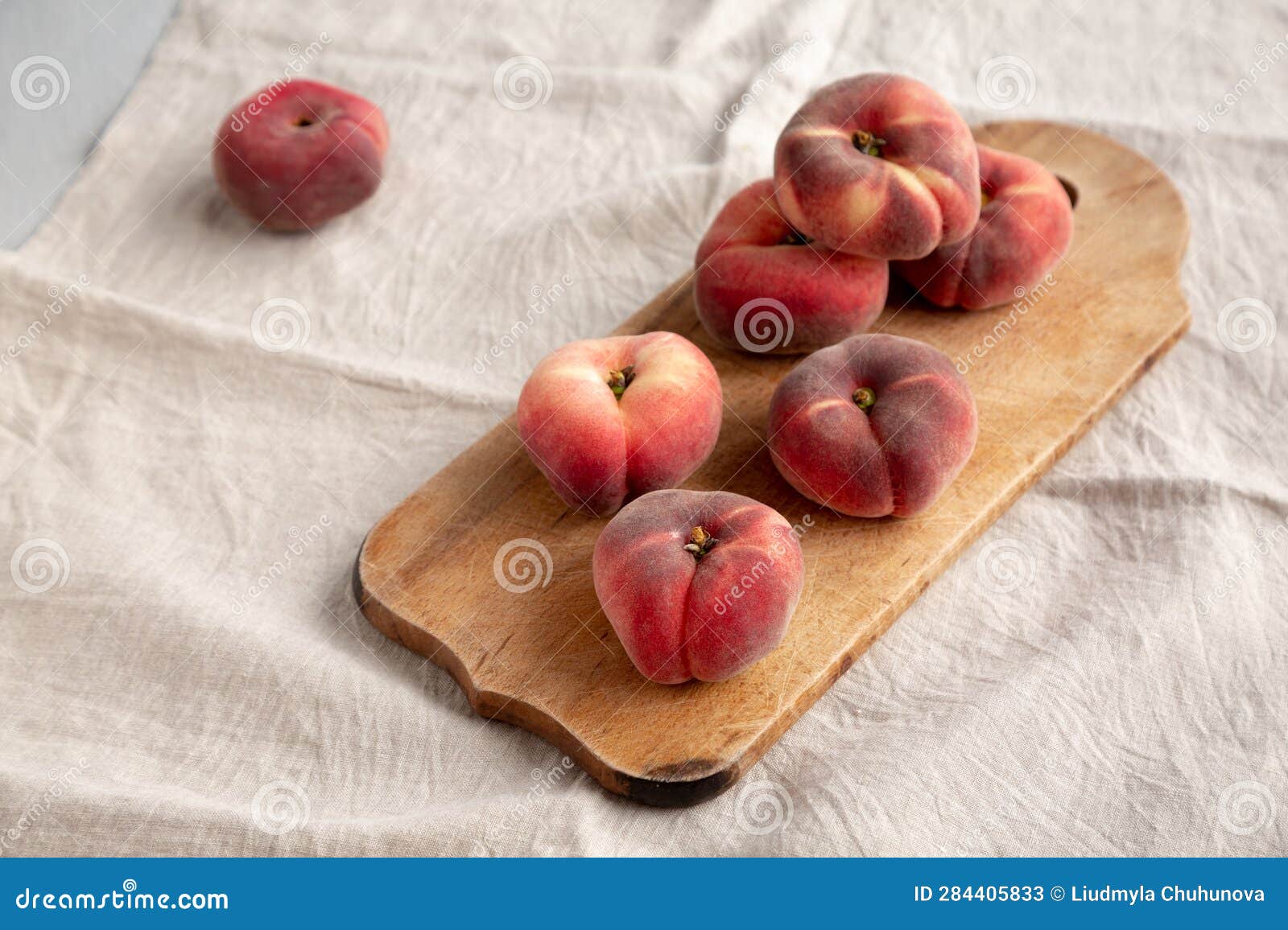Organic Donut Saturn Peaches on a Rustic Wooden Board, Side View Stock ...