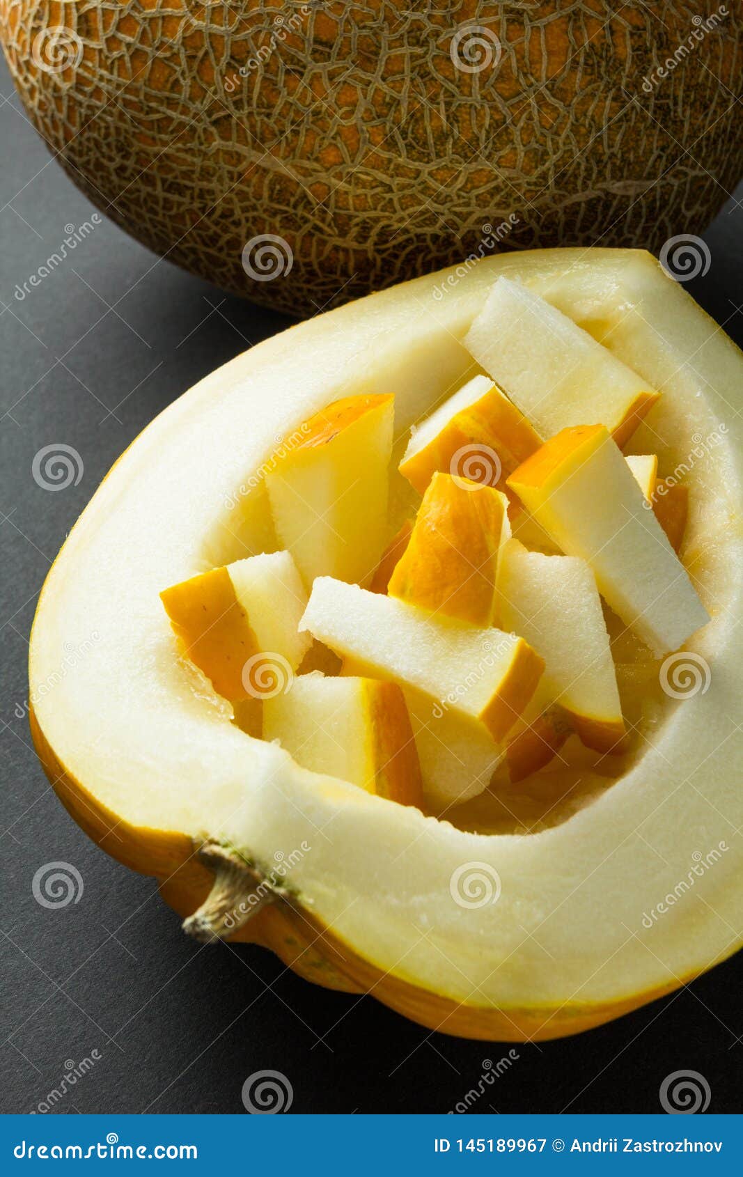 Organic Fresh Yellow Melon Slices on Black Background, Vertical Stock ...
