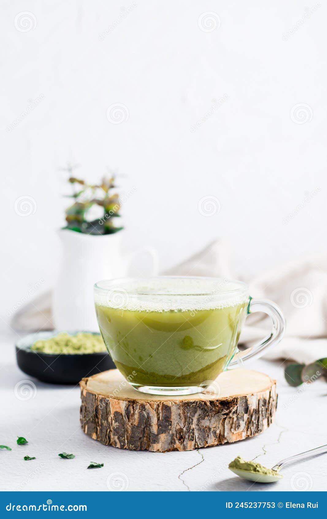 Organic Green Matcha Tea in a Cup on a Tree Trunk on the Table ...