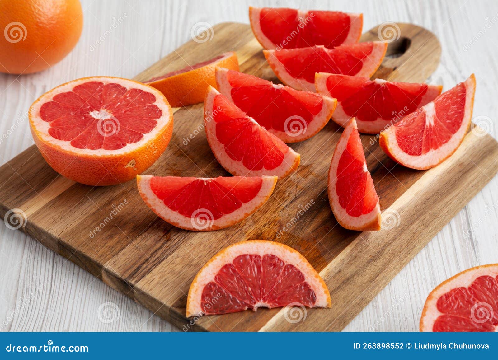 Organic Red Ruby Grapefruit on a Wooden Board, Side View Stock Photo ...