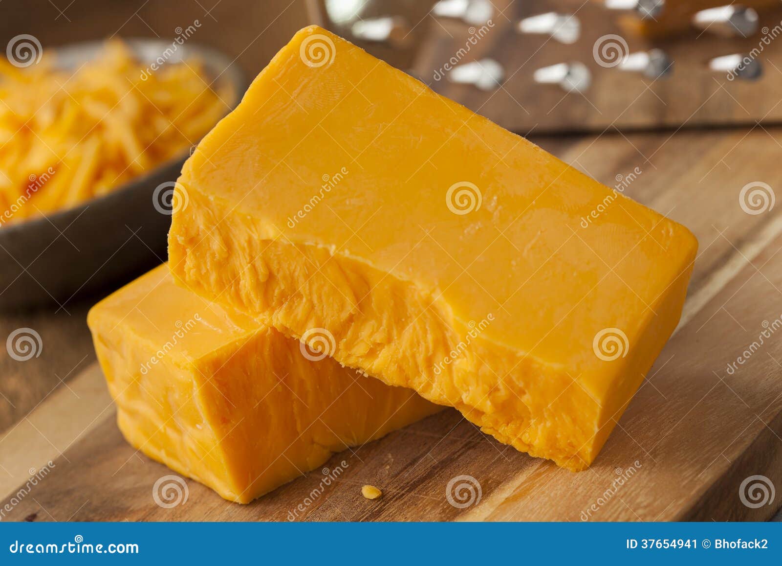 Sharp Cheddar Cheese Being Sliced Stock Photo | CartoonDealer.com #18433614