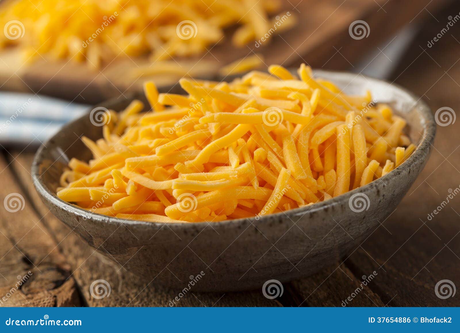 Organic Shredded Sharp Cheddar Cheese Stock Photo - Image of food ...
