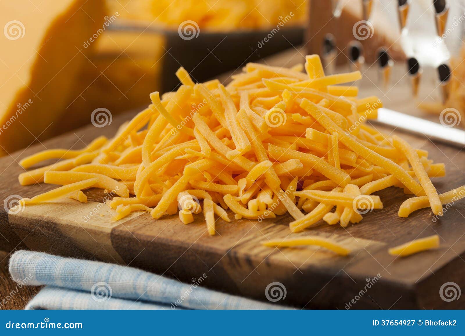 Organic Shredded Sharp Cheddar Cheese Stock Image - Image of cube ...