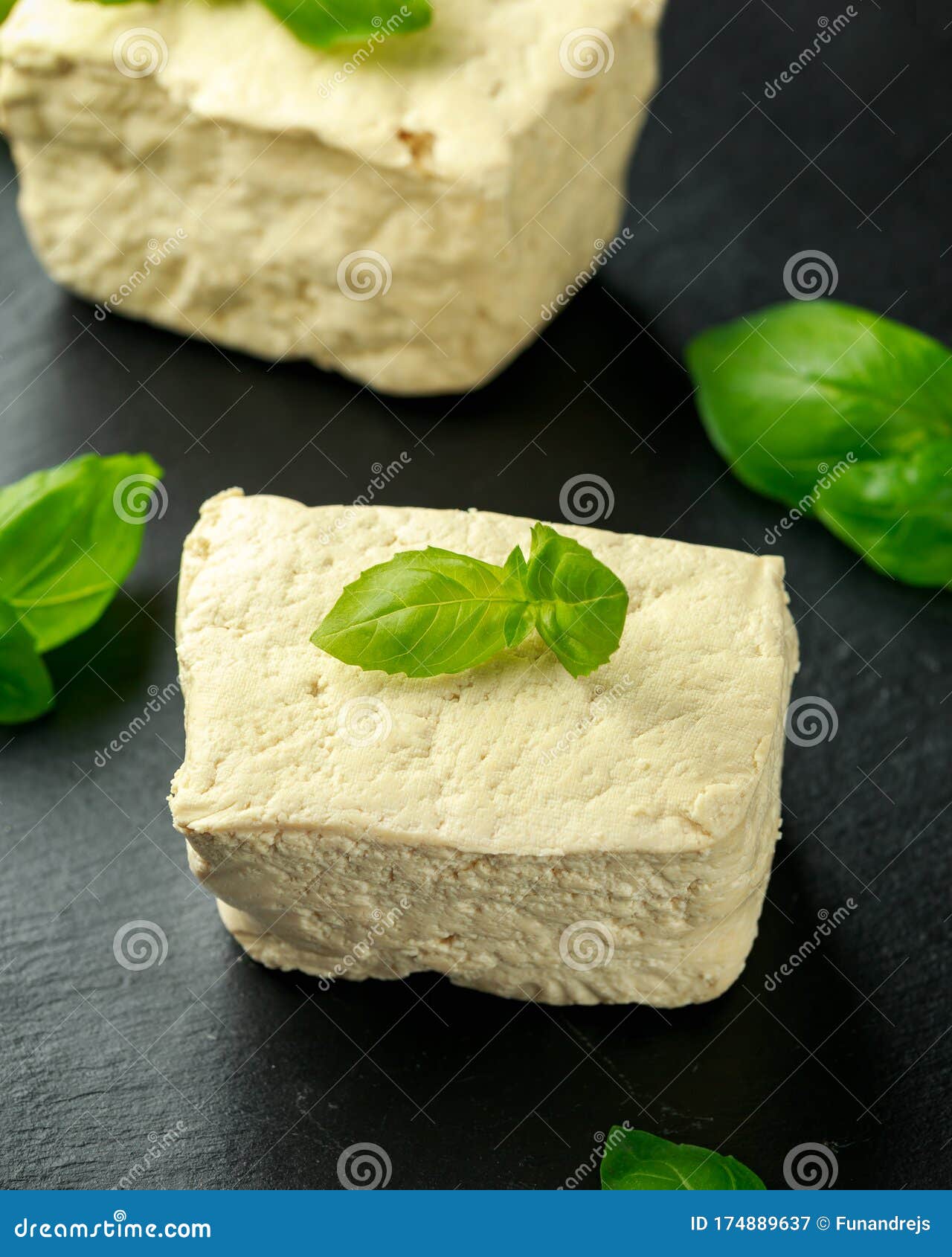 Organic Soy Tofu with Basil on Dark Rustic Stone Board. Stock Image ...