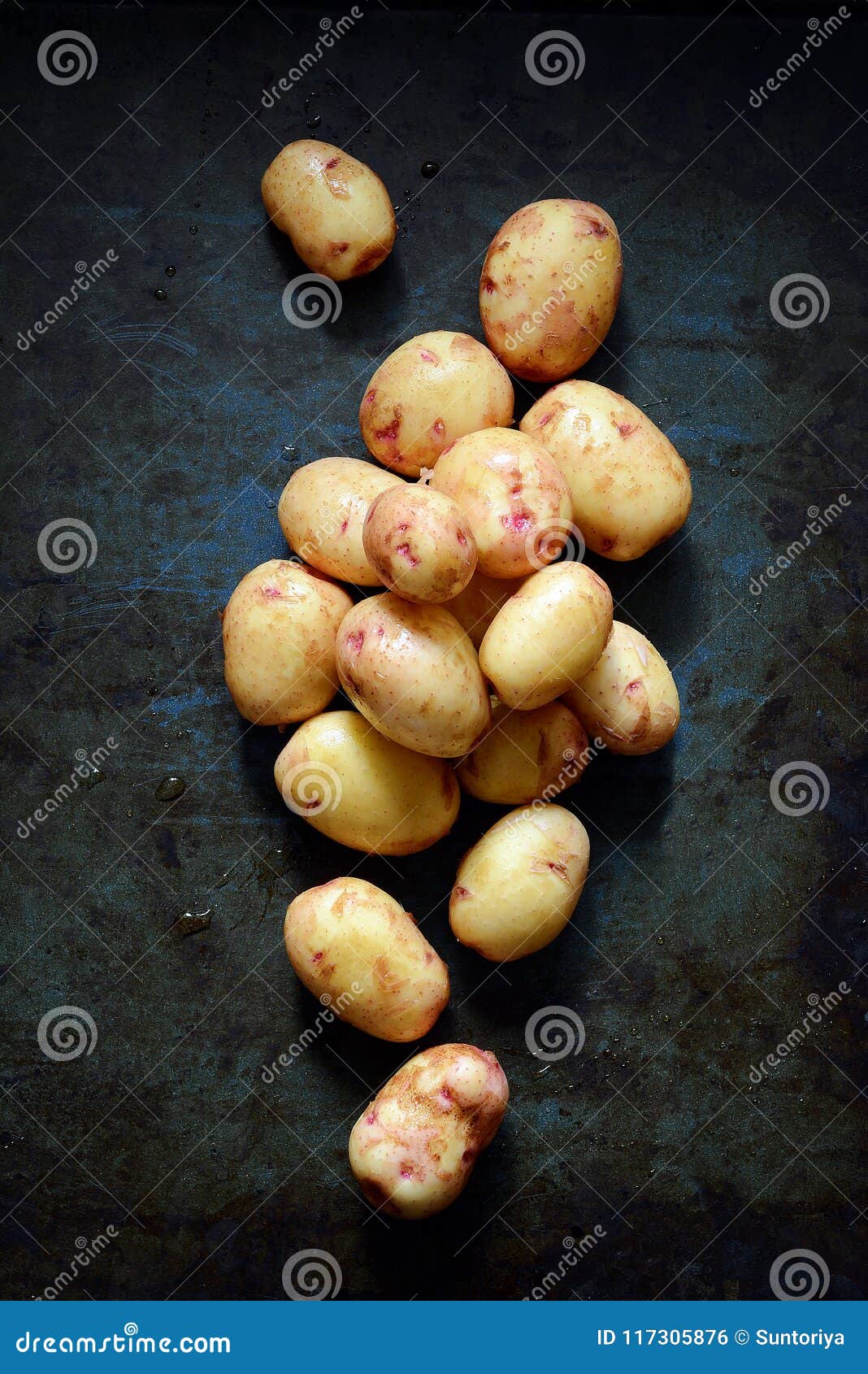 Organic Young Potatoes on a Dark Background. Heap of Potatoes Root ...