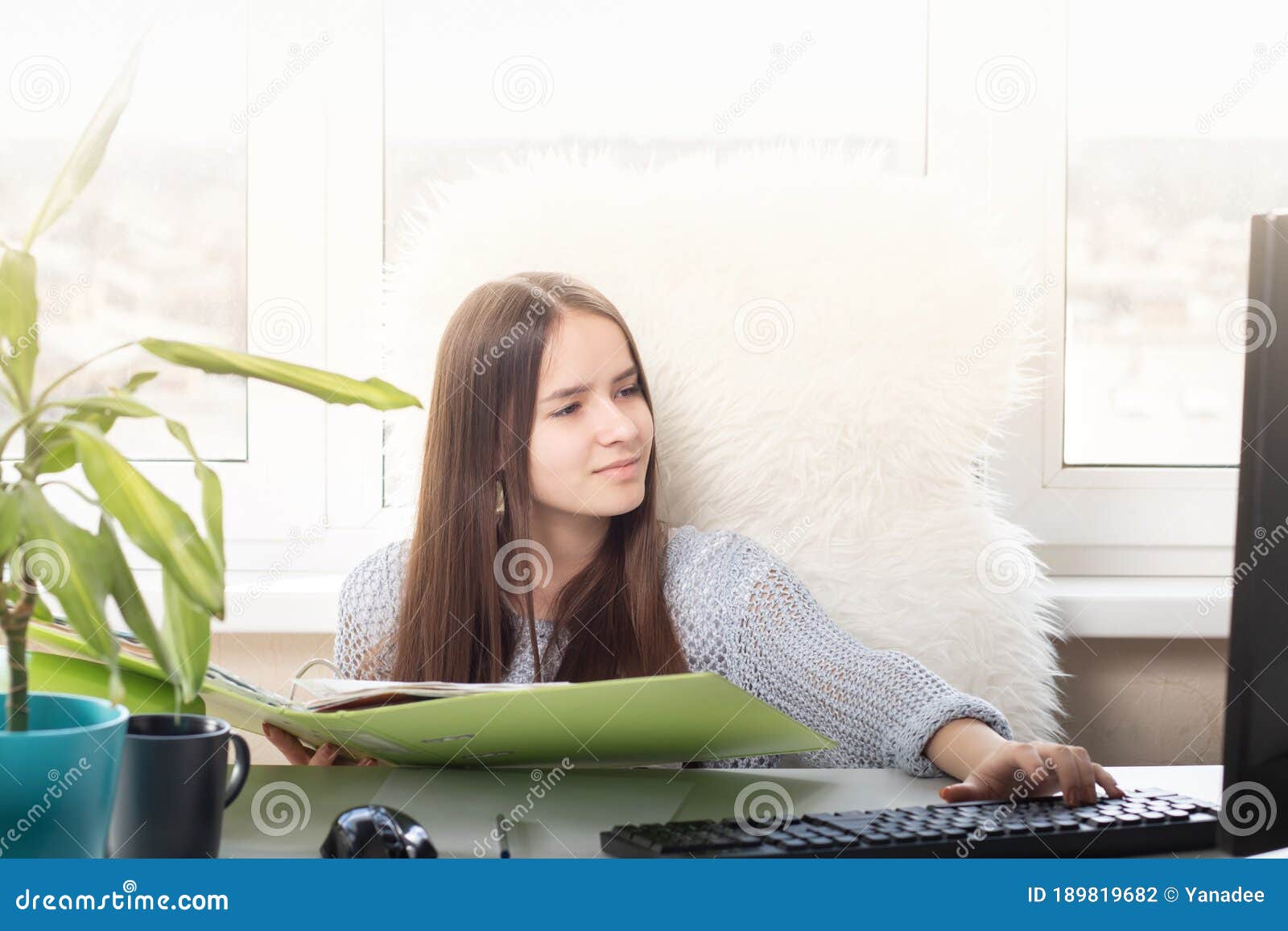 Organization of Home Office, Remote Work Device. a Young Girl Sits at a ...
