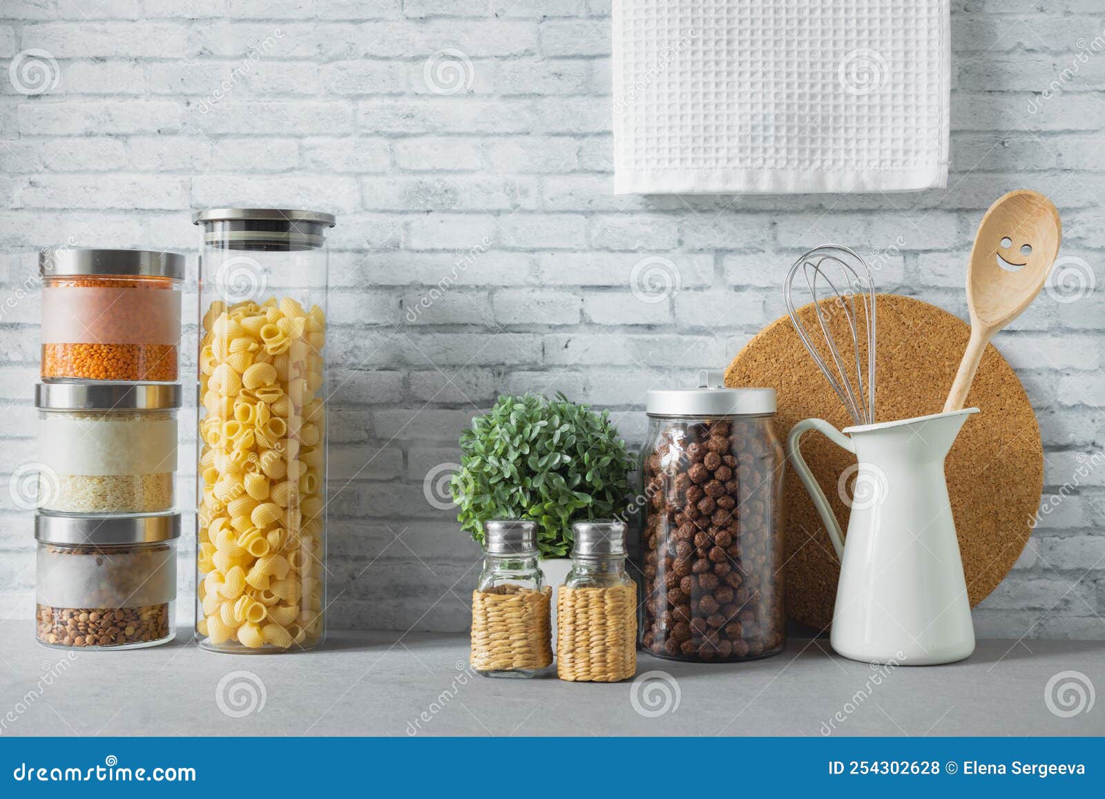Organization of Storage in the Kitchen. Pasta, Rice and Cereal in Glass ...