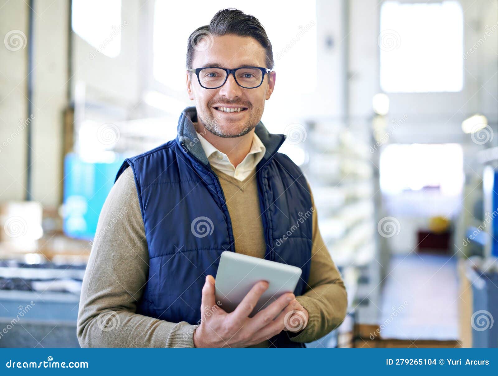 Organized and Efficient. a Man Working in a Large Warehouse. Stock ...