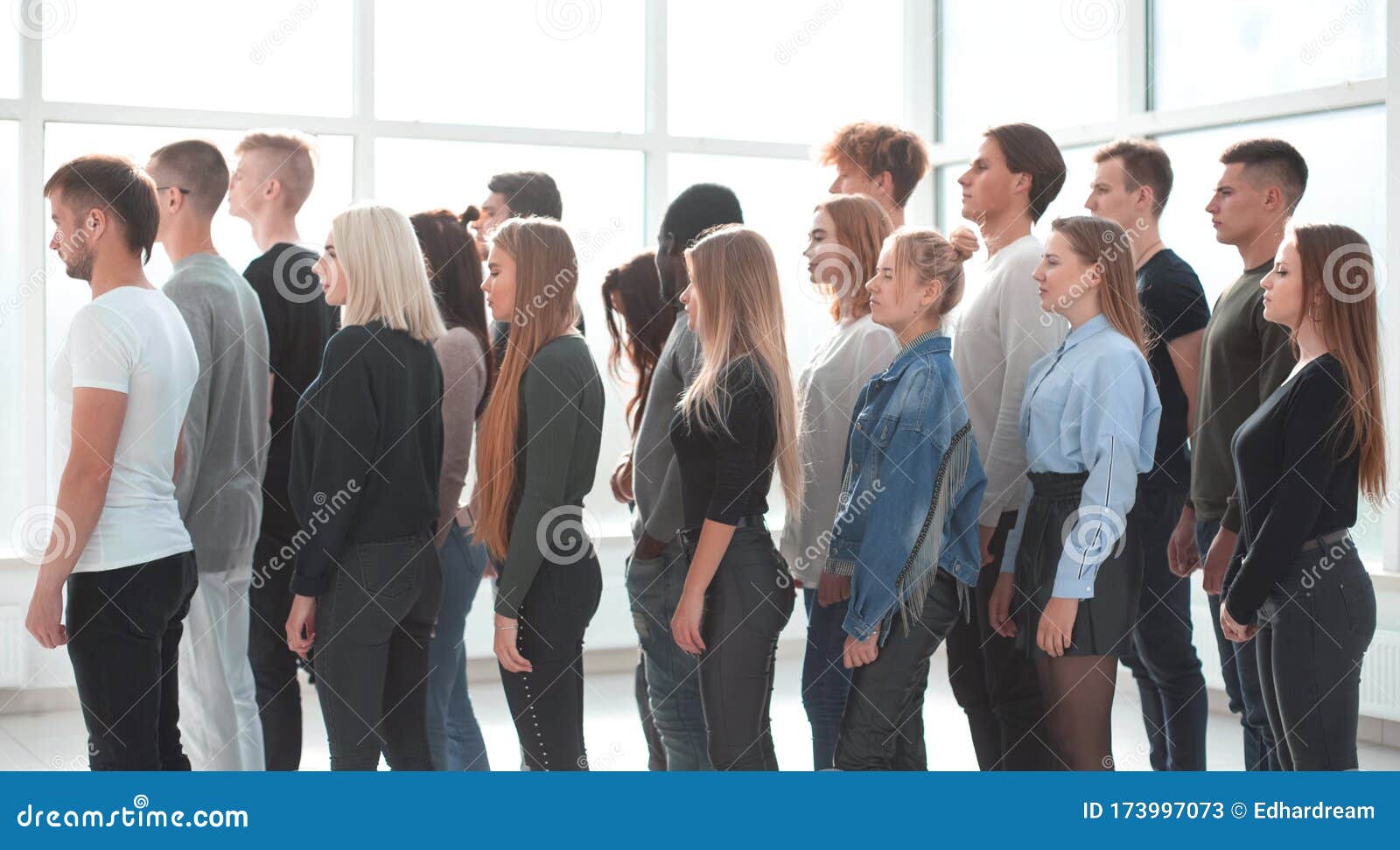 Organized Group of Casual Young People Standing in a Column Stock Image ...