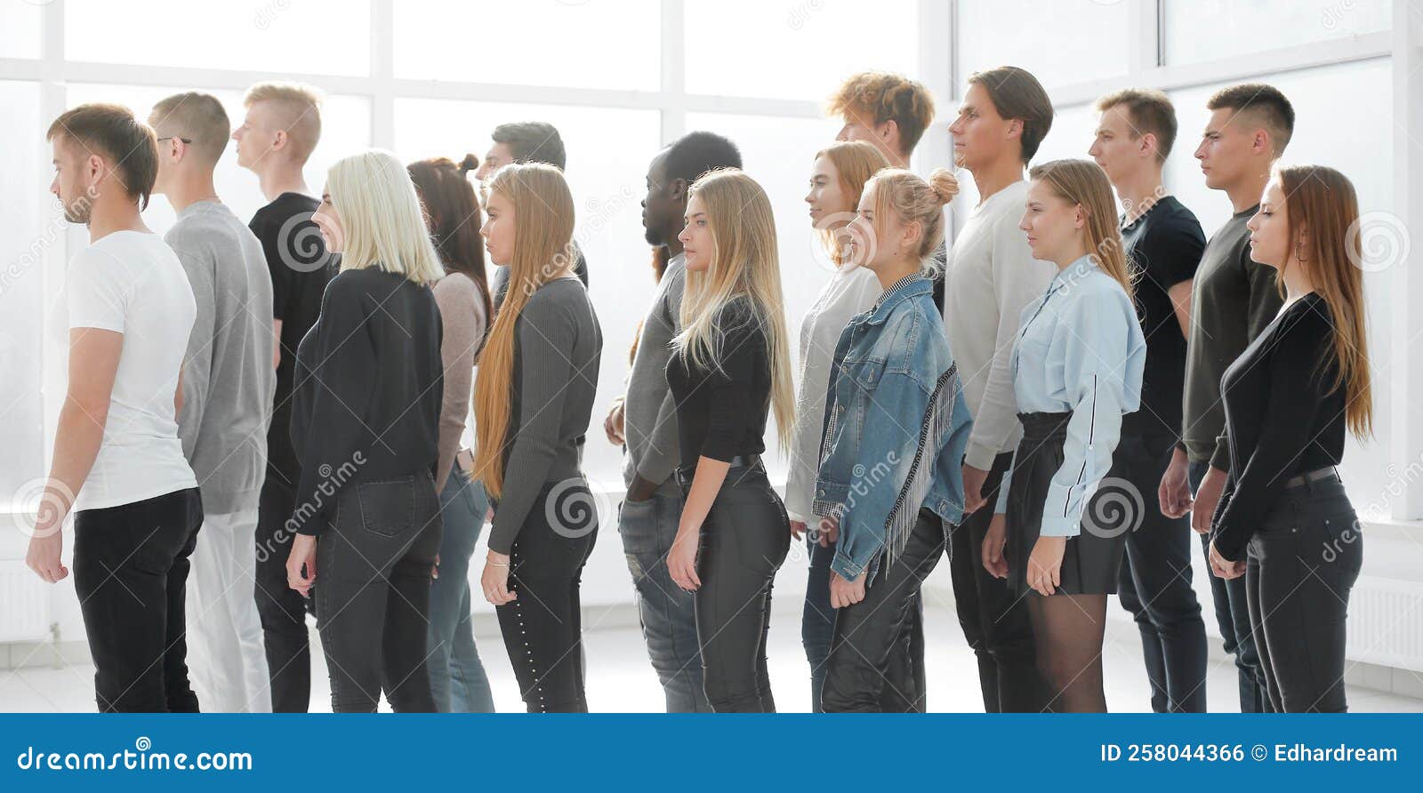 Organized Group of Casual Young People Standing in a Column Stock Photo ...