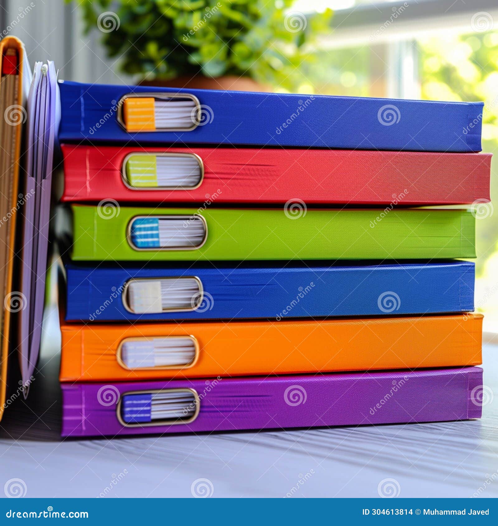 Organized Workspace Stack of Colorful File Folders on Office Table ... Organized Workspace Stack of Colorful File Folders on Office Table ...