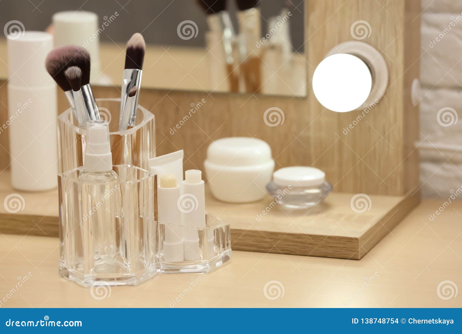 Organizer with Cosmetic Products and Makeup Accessories on Dressing ...