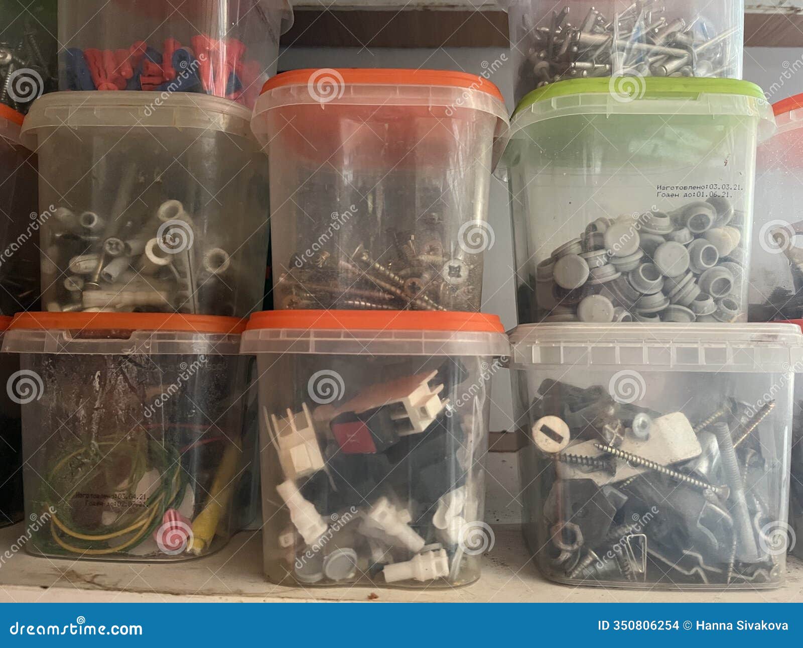Organizing Assorted Hardware Items in Clear Storage Containers on a ...