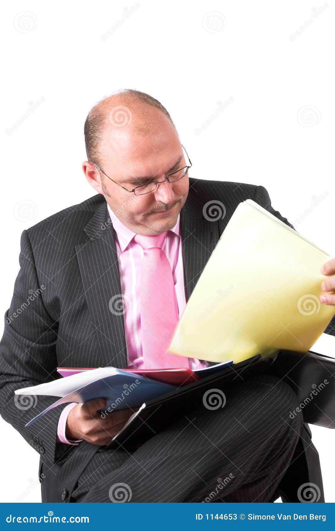 Organizing his files stock image. Image of businessman - 1144653