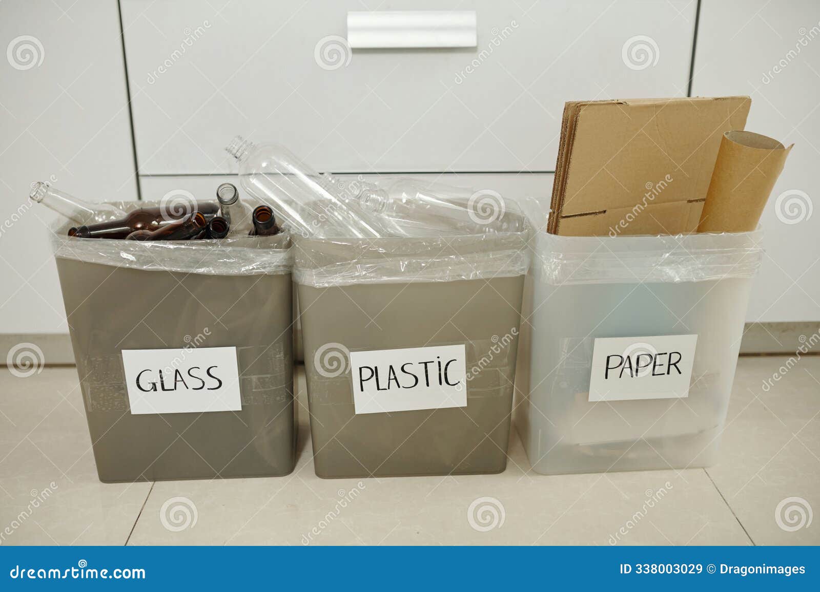 Organizing Recycling Bins for Glass Plastic and Paper Waste Stock Image ...