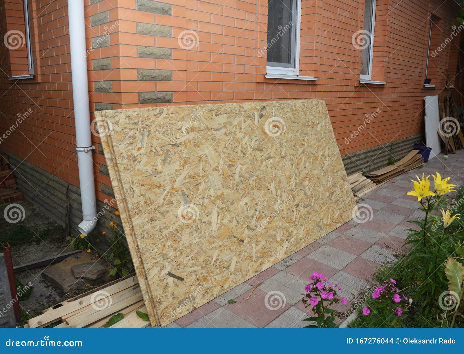Oriented Strand Board OSB Near Brick House Wall Stock Photo - Image of ...