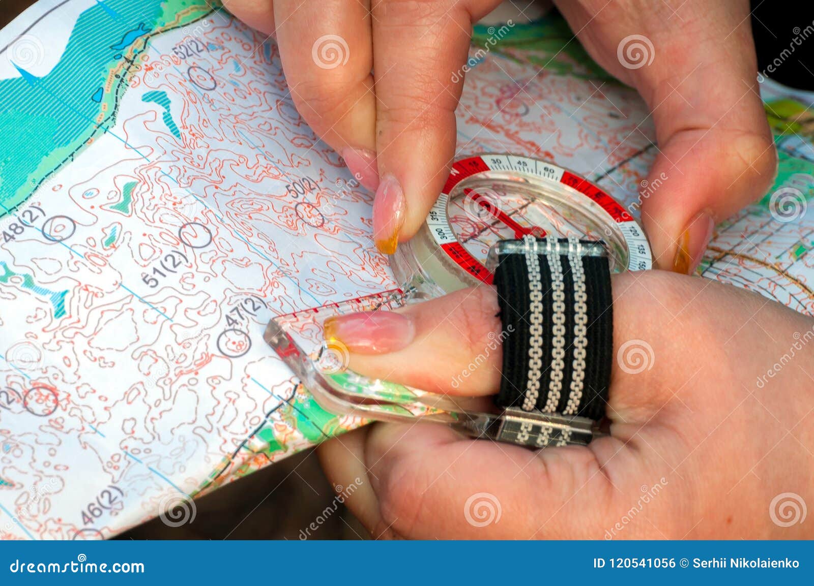 Orienteering. Compass and Topographic Map. the Athlete Uses Navigation ...