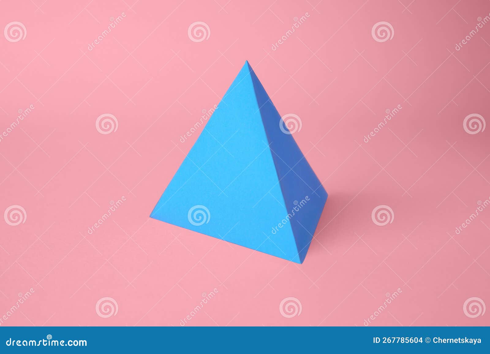 Origami Art. Paper Pyramid on Pink Background Stock Photo - Image of ...