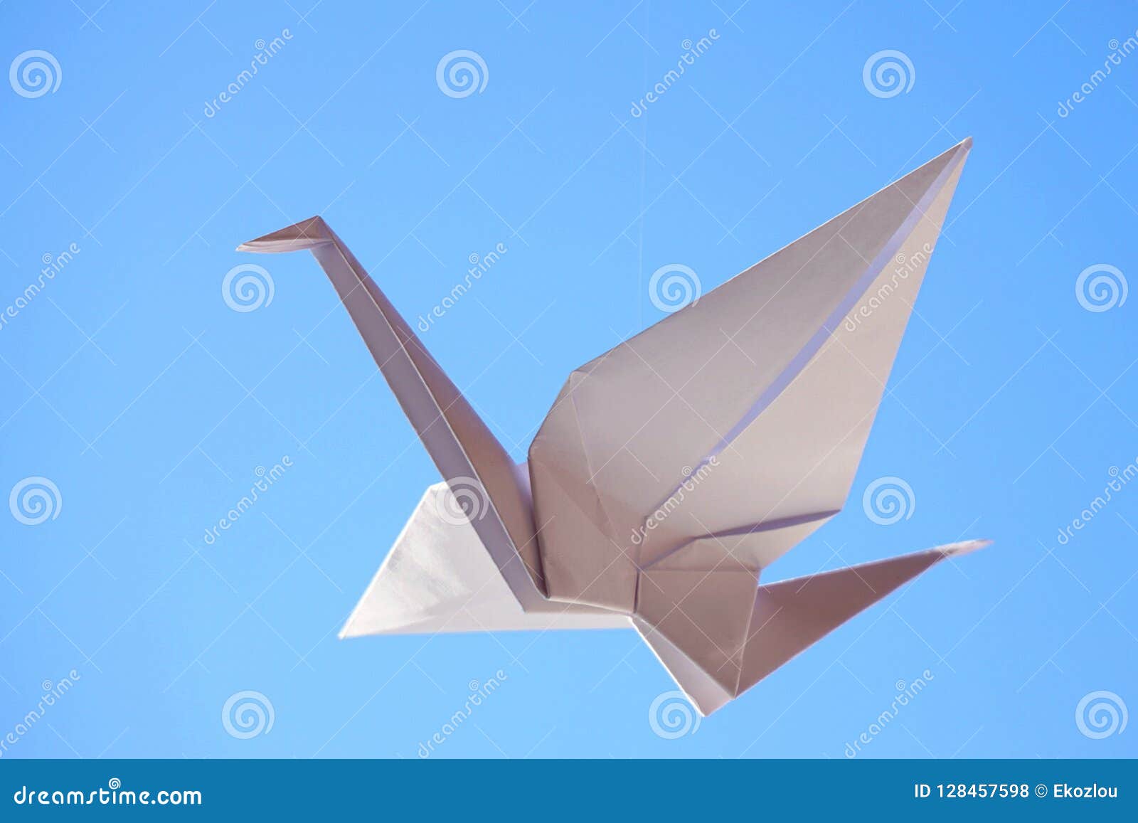Origami Bird. Flying Origami Bird On Blue Background Royalty-Free Stock ...