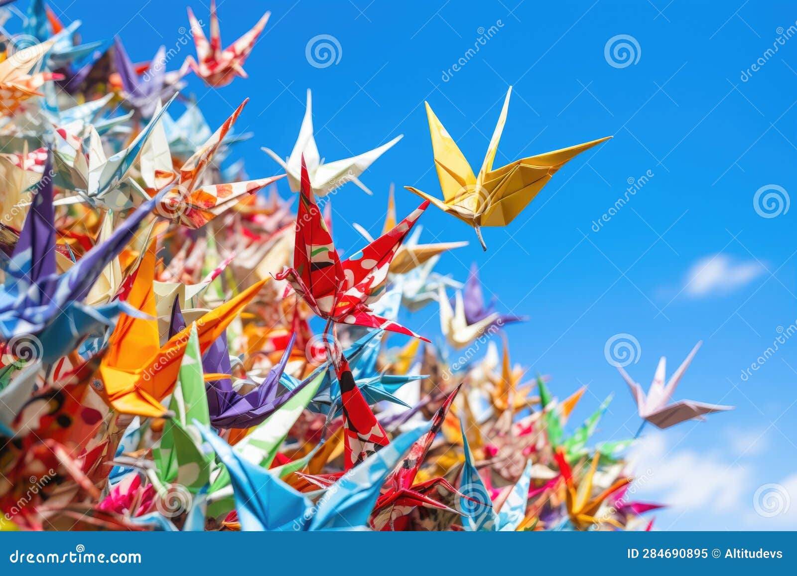 Origami Cranes in Flight Against a Blue Sky Background Stock Image ...