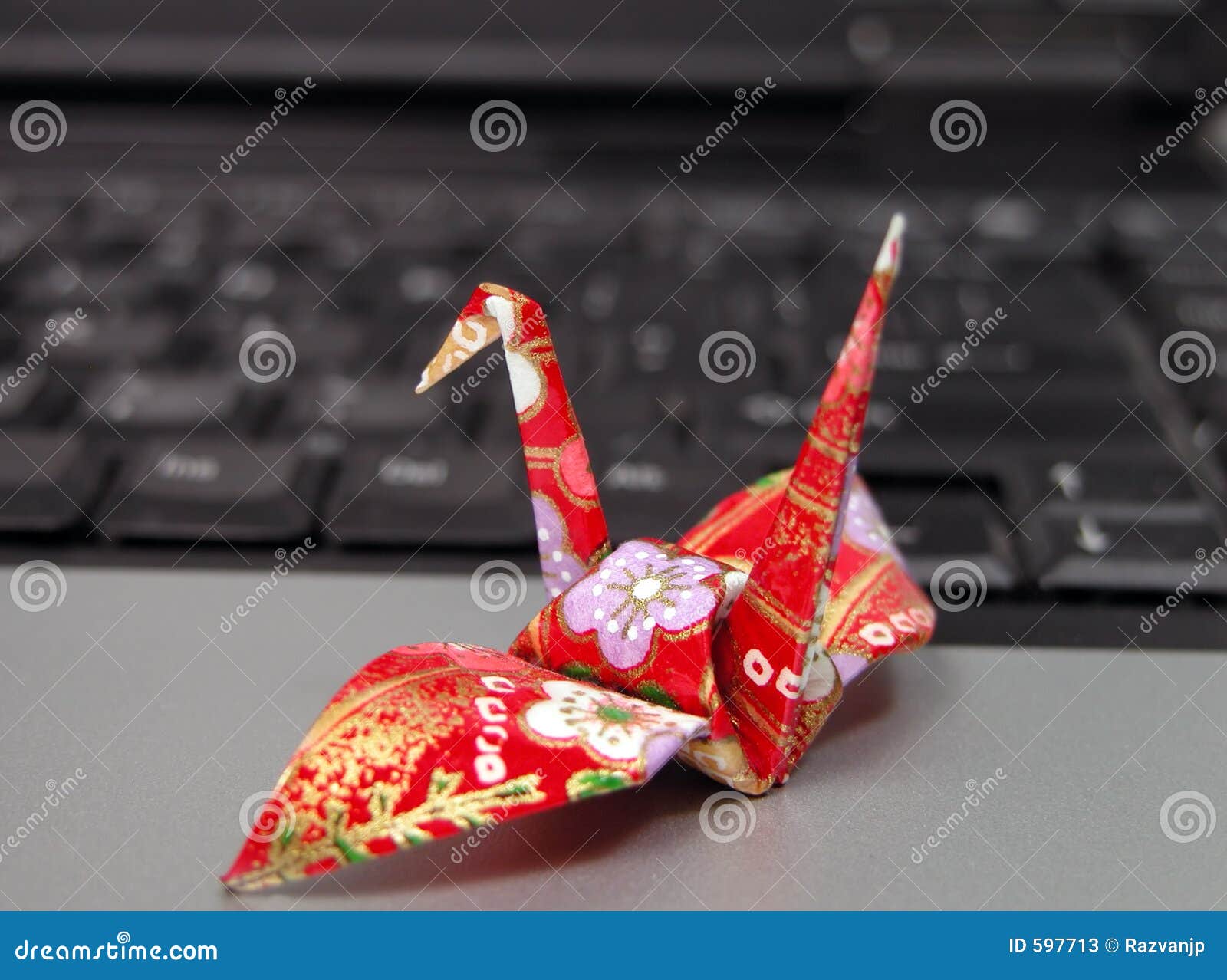 Origami on laptop stock image. Image of tradition, crane - 597713