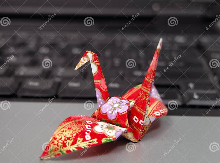 Origami on laptop stock image. Image of tradition, crane - 597713