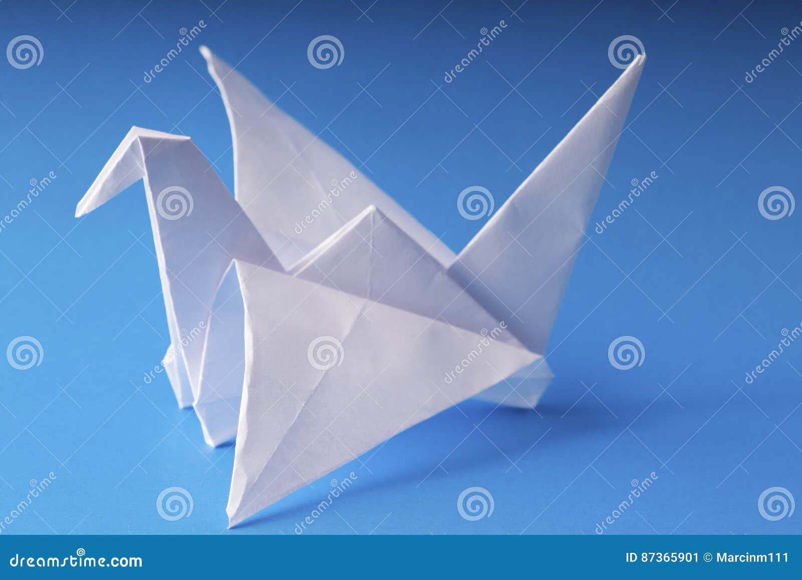 Origami Paper Crane on Blue Stock Image - Image of hope, creative: 87365901