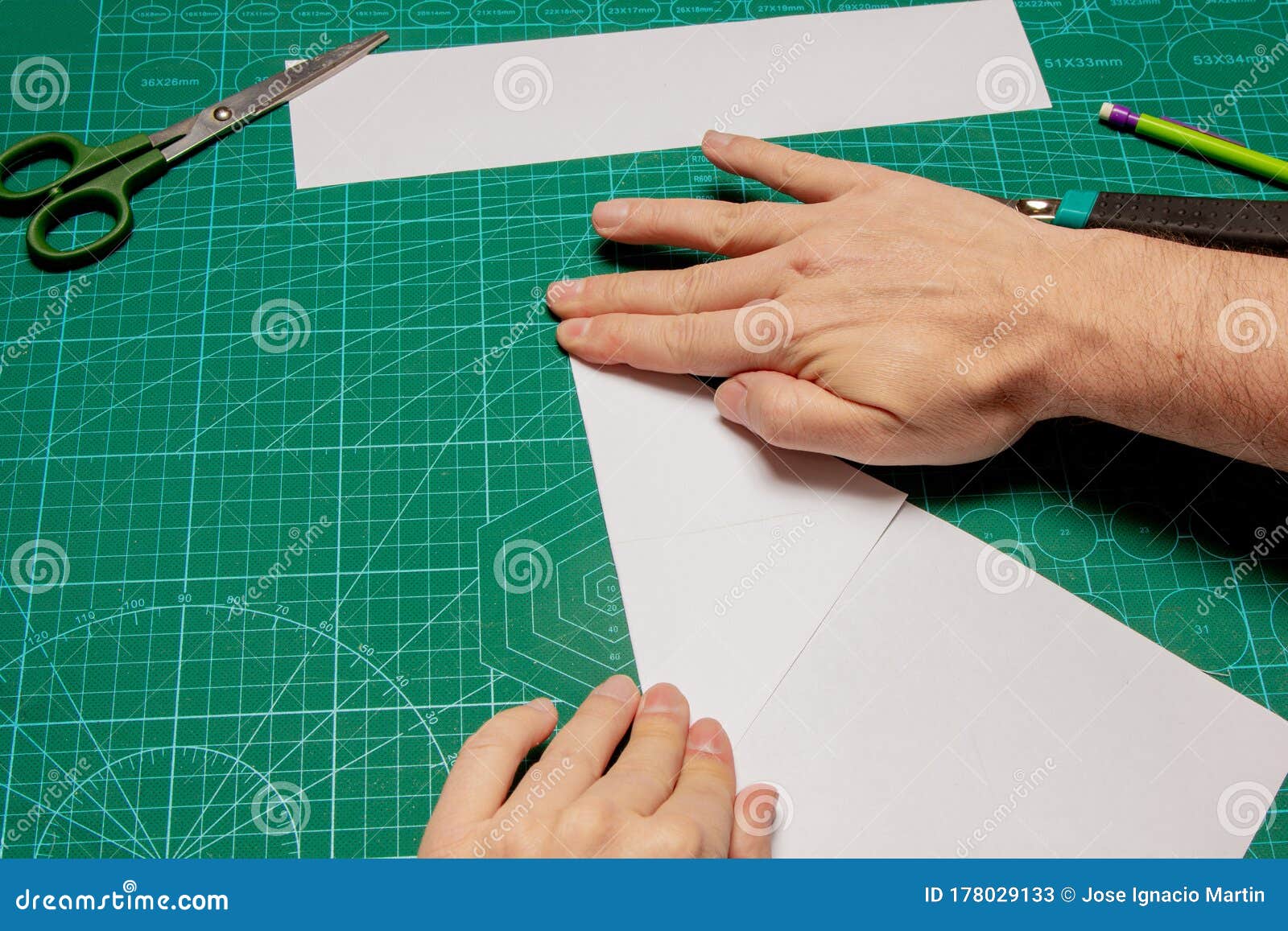 Origami Project On White Paper With Cutter And Scissors Stock Image ...