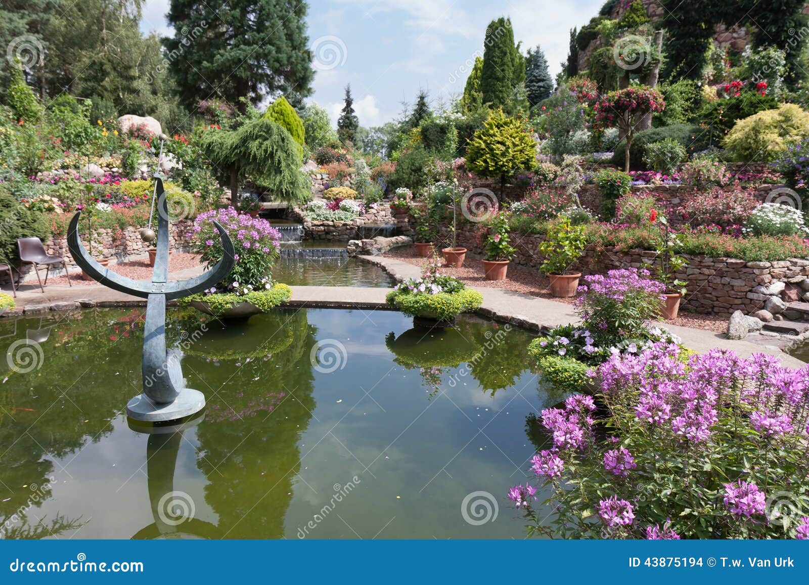 Ornamental Garden with Pond and Blooming Flowers Stock Photo - Image of ...