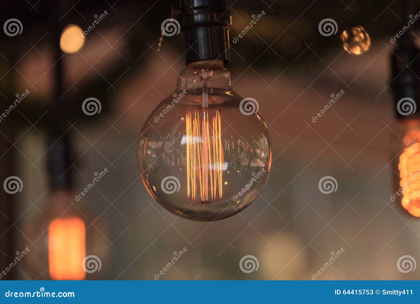 Ornamental light bulb lit stock image. Image of lamp - 64415753
