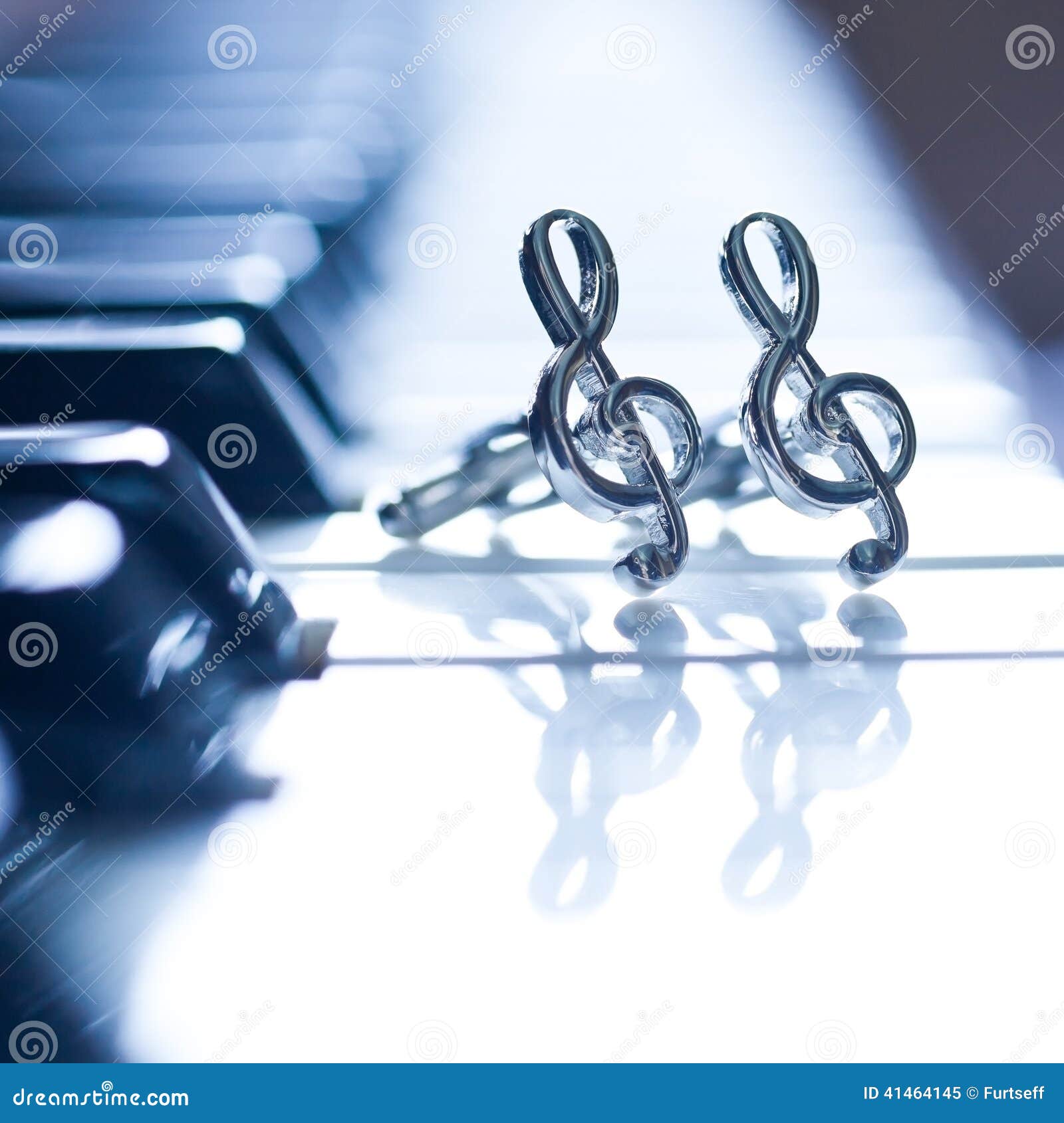 Ornaments in the Form of a Treble Clef on Piano Keyboard Stock Image ...
