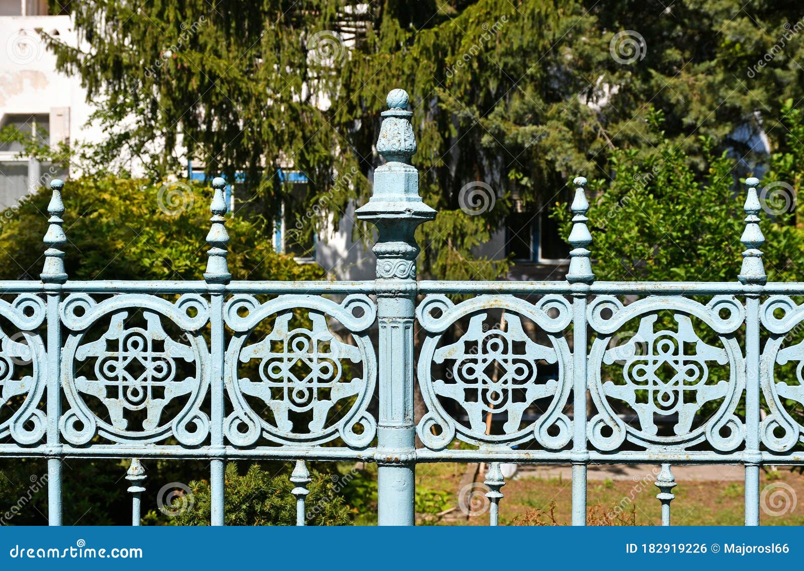 Ornate Metal Fence in Front of a Tree Stock Photo - Image of green ...
