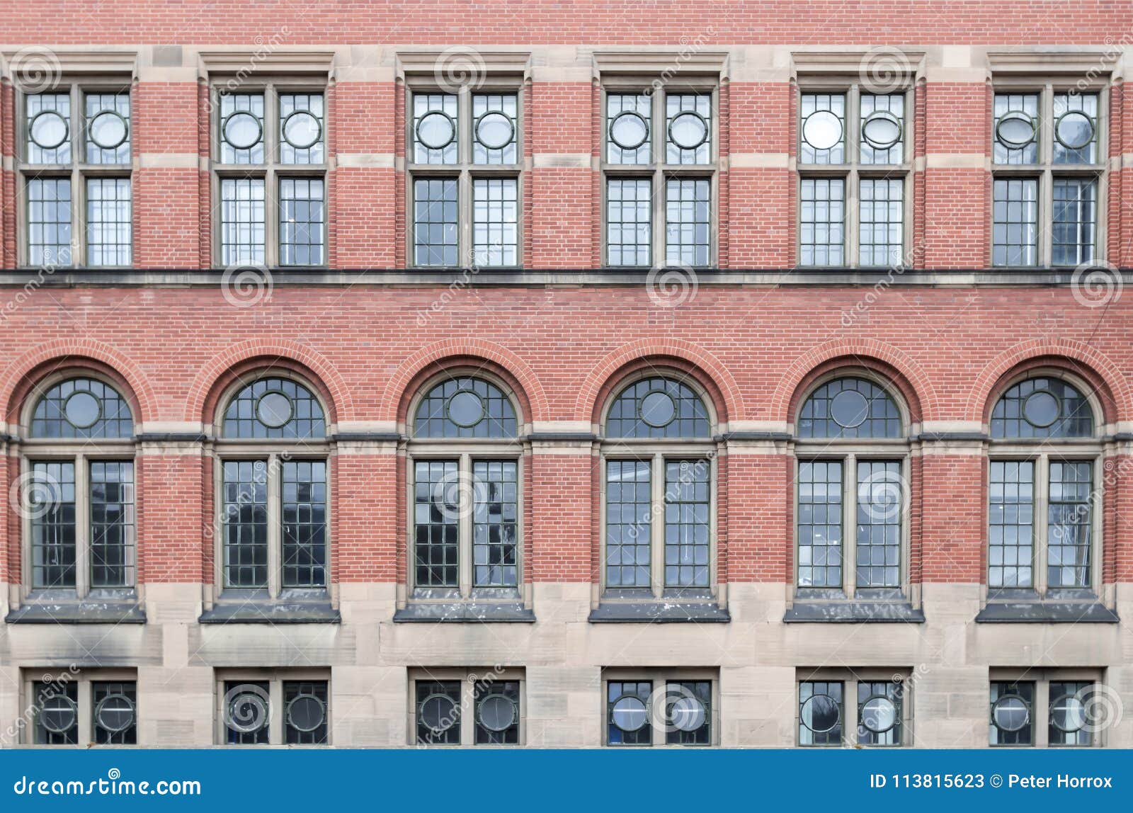 Ornate Windows in a Red Brick Wall Stock Image - Image of historical ...
