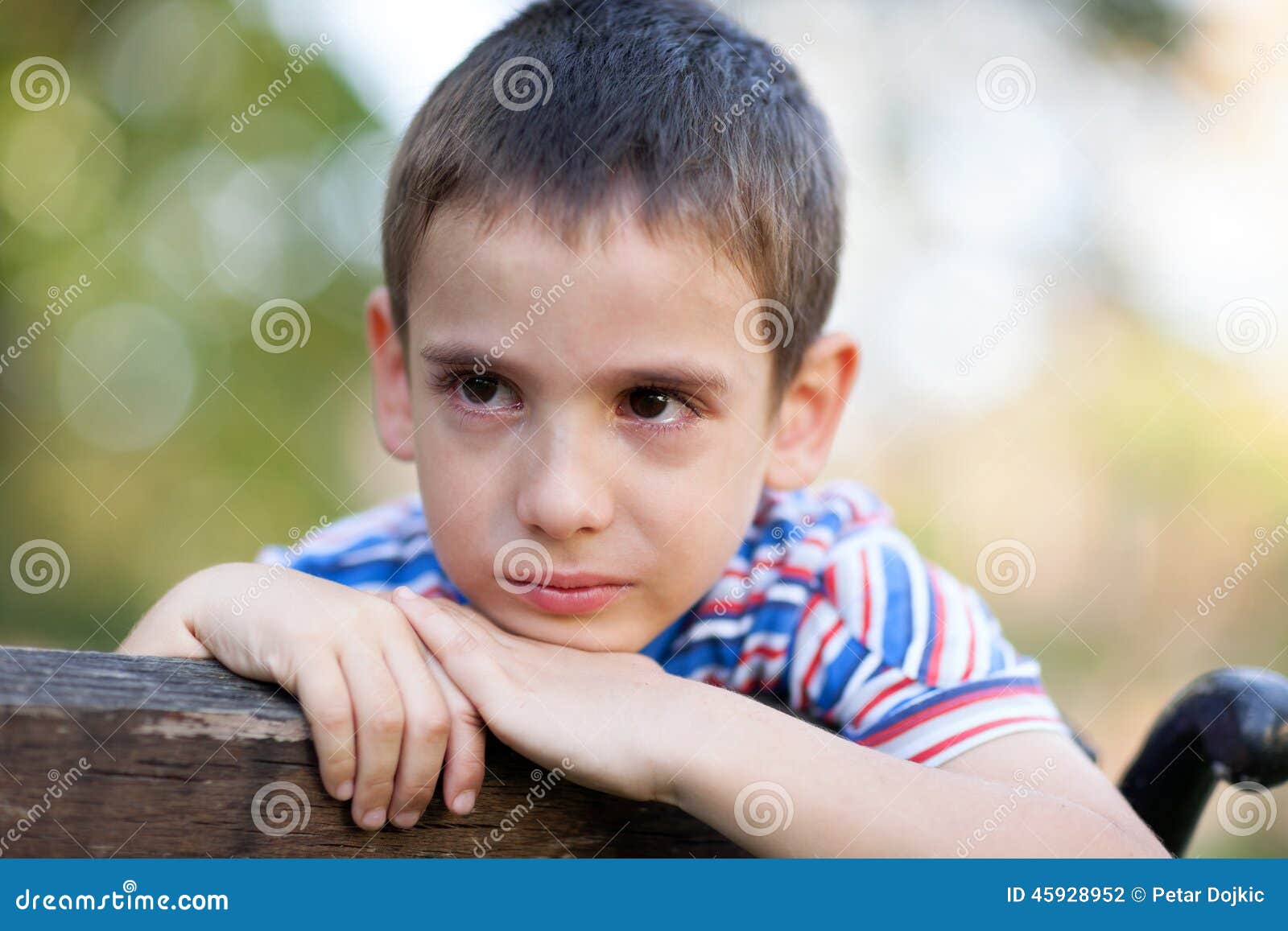 Orphan, Unhappy Boy Sitting on a Park Bench and Crying Stock Photo ...