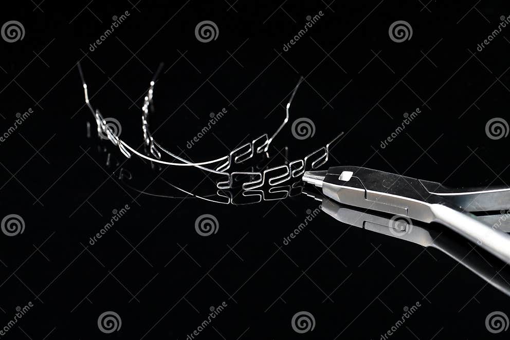 Orthodontics Tool Multiloop Braces System, on Black Background Stock ...