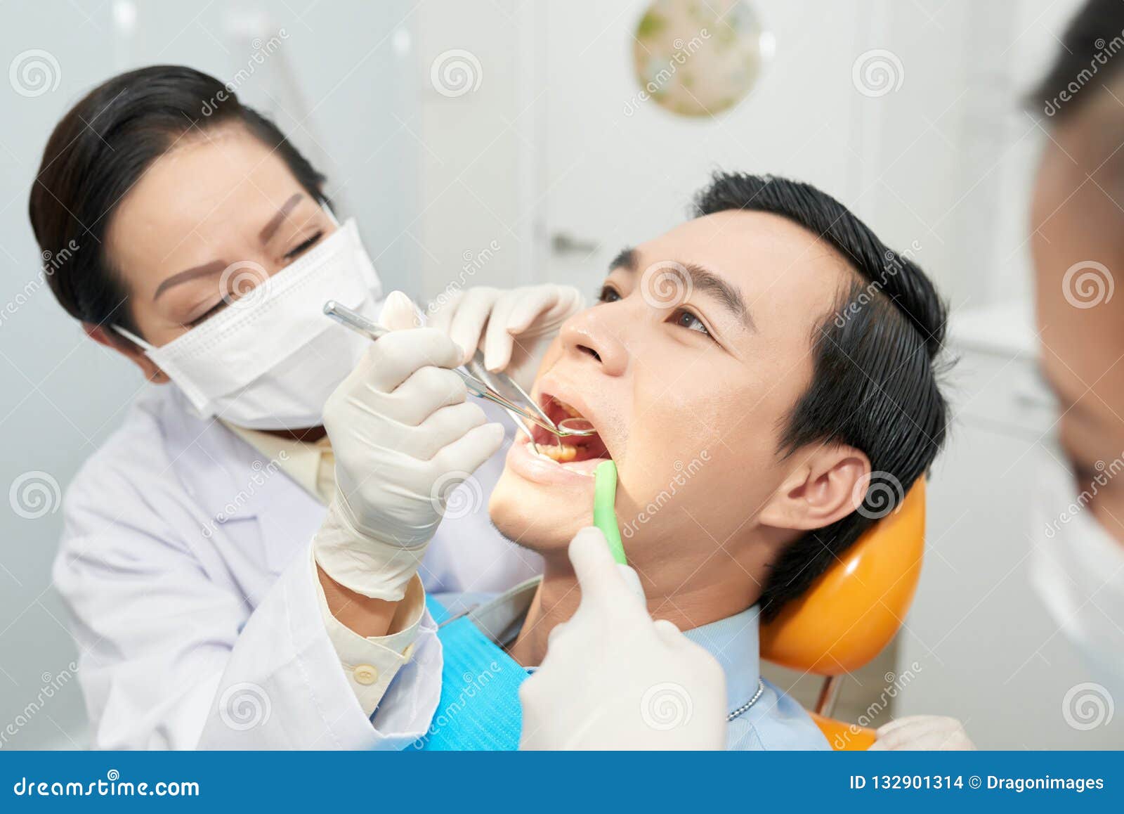 Orthodontist Checking Teeth Stock Photo - Image of dentistry, dentist ...