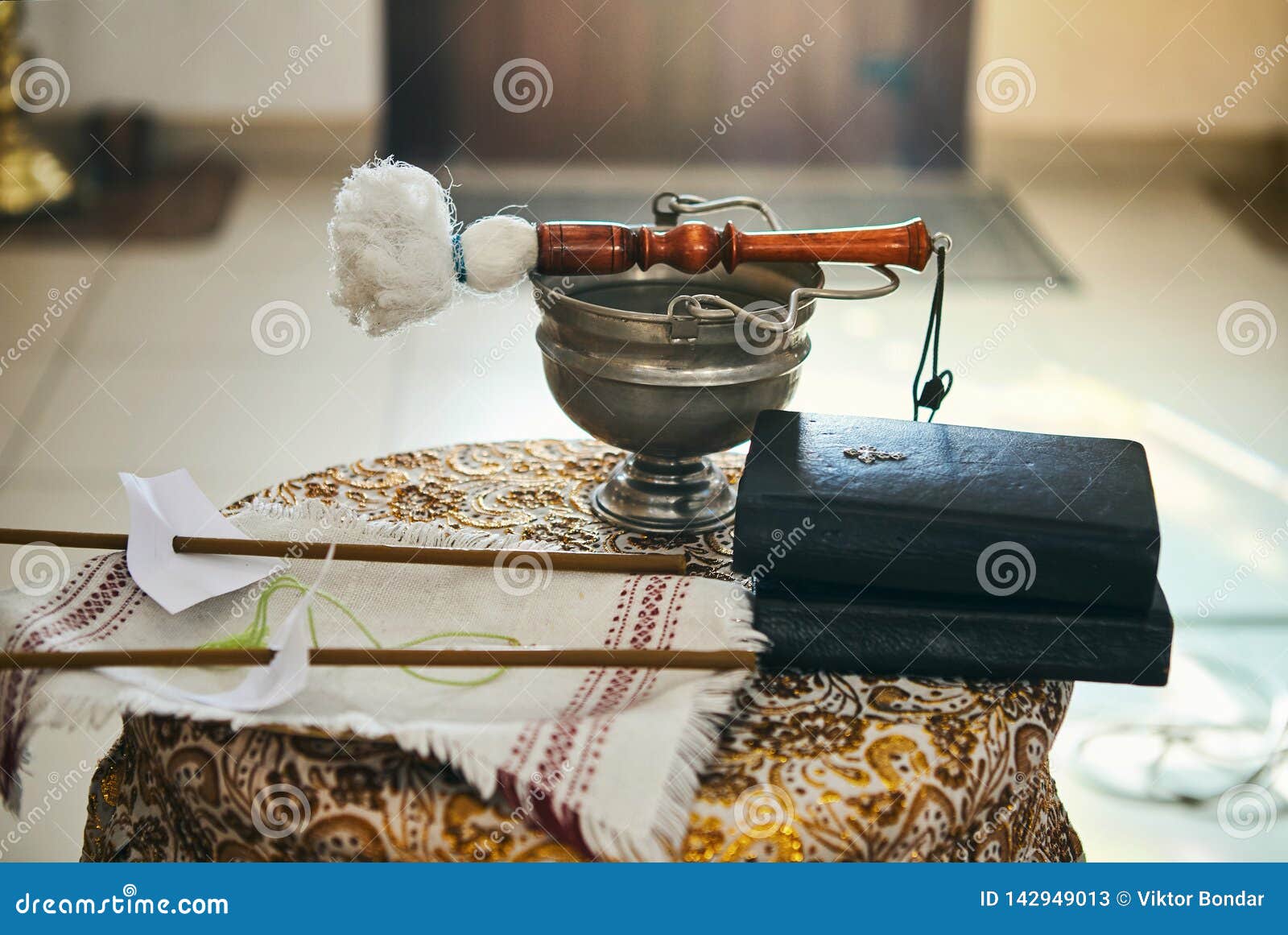 Orthodox Priest Holds a Bible on a Table with Various Objects Needed ...