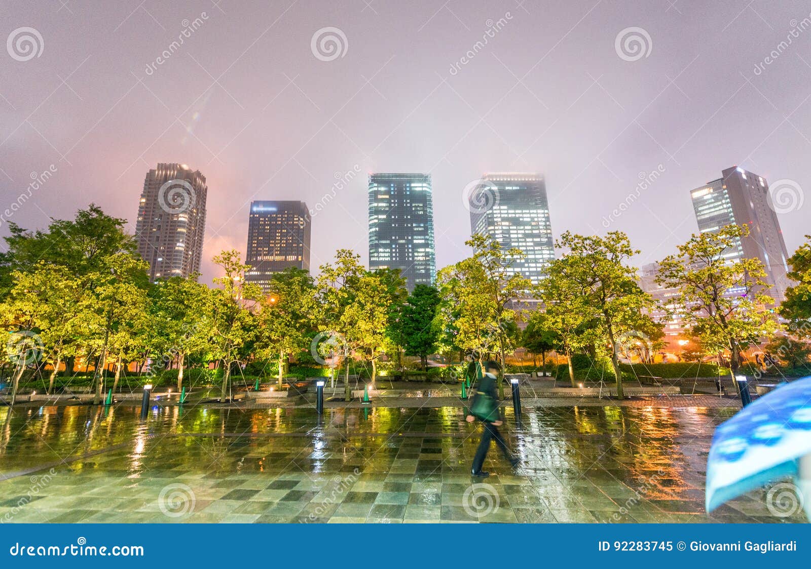 Osaka Night Skyline with Rain and Colourful Umbrella, Japan Editorial ...