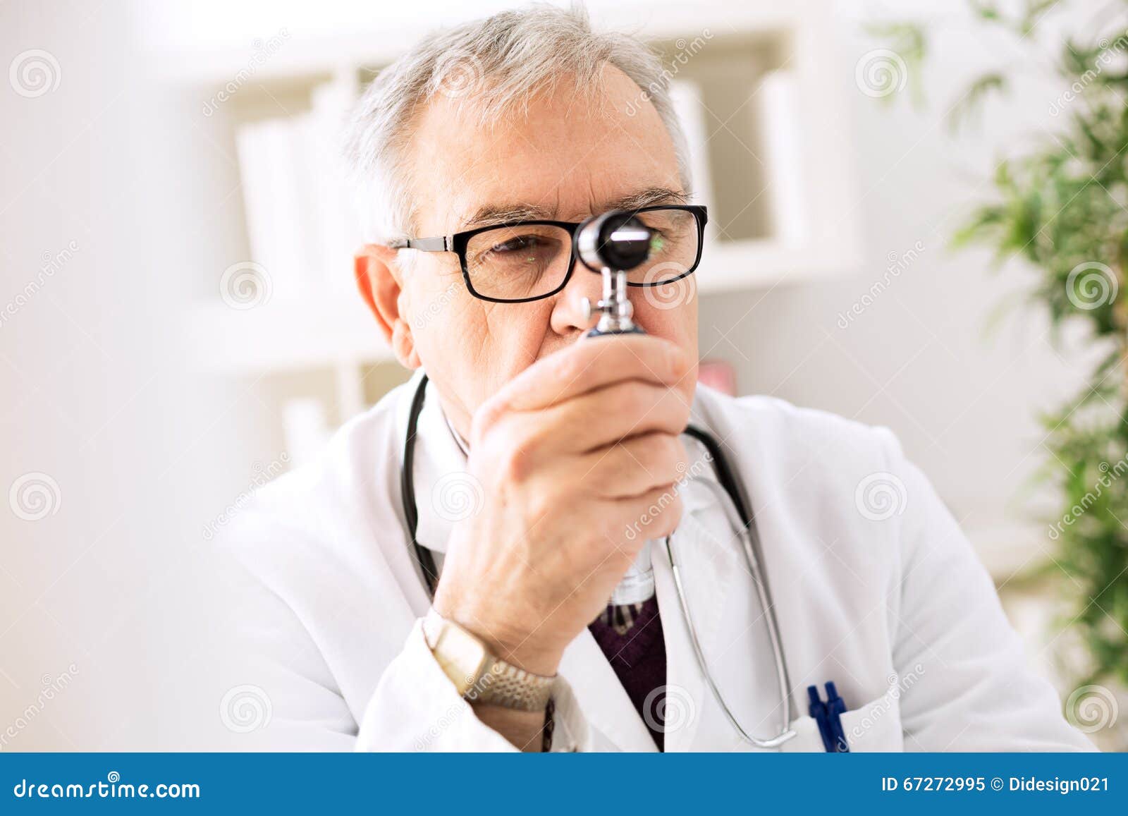 Otolaryngologist Looking through Otoscope Stock Image - Image of clinic ...