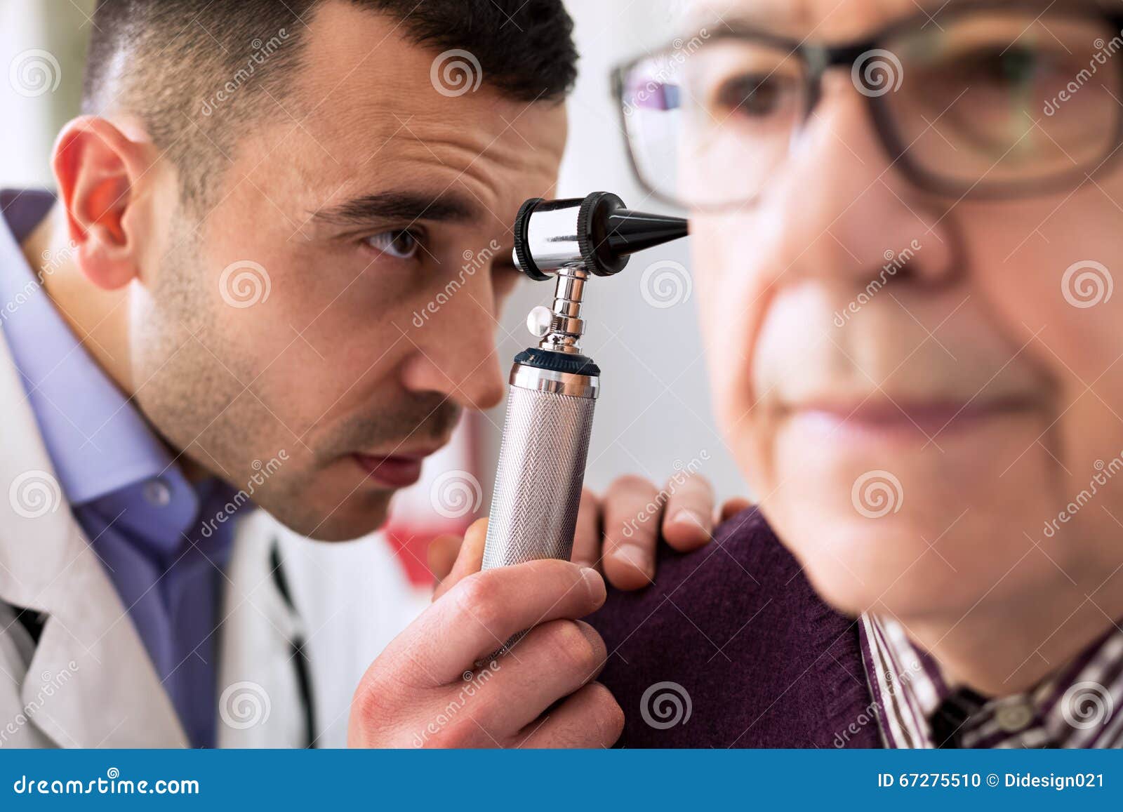 Otologist Examining Patient Ear Stock Photo - Image of physician ...