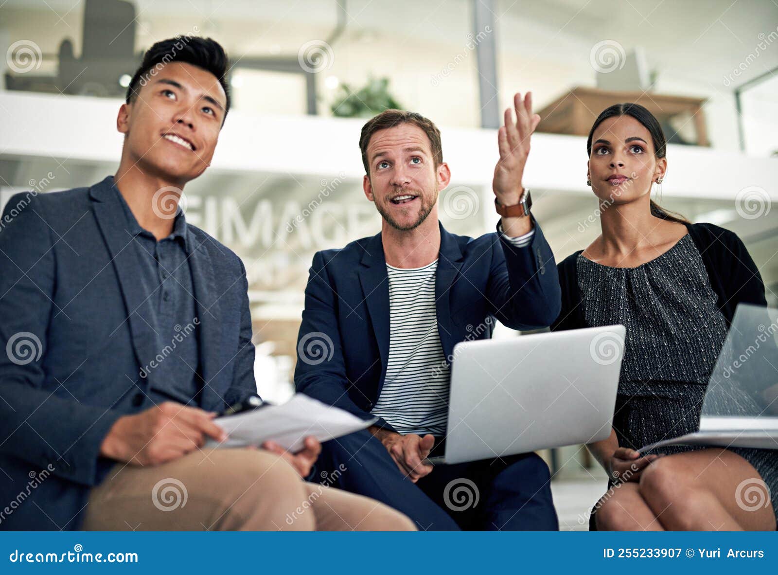 Our Future is Bright. Three Colleagues Working in the Office. Stock ...