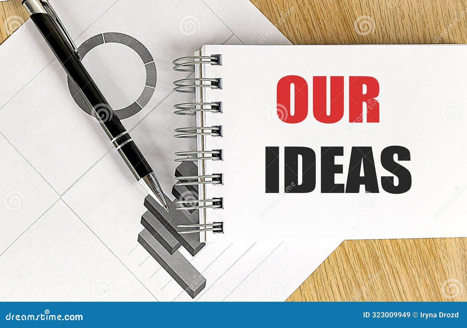OUR IDEAS Text on Notebook with Chart on Wooden Background Stock Image ...
